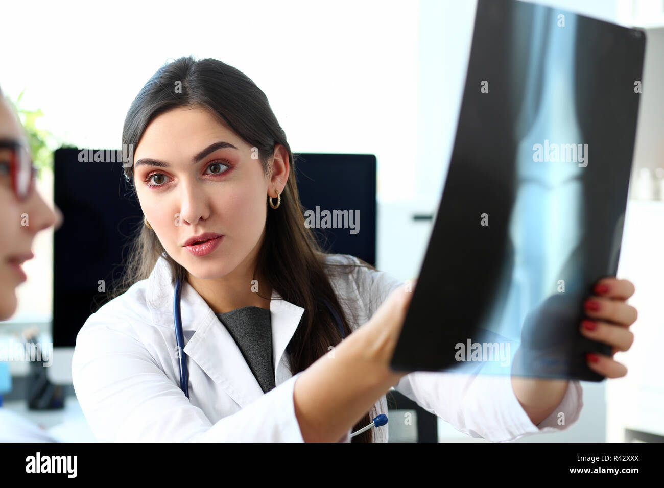 Doctor look at x ray hi-res stock photography and images - Alamy