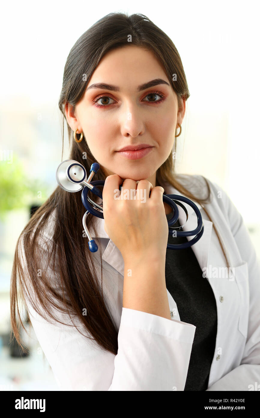 Beautiful smiling female doctor sit at workplace Stock Photo - Alamy