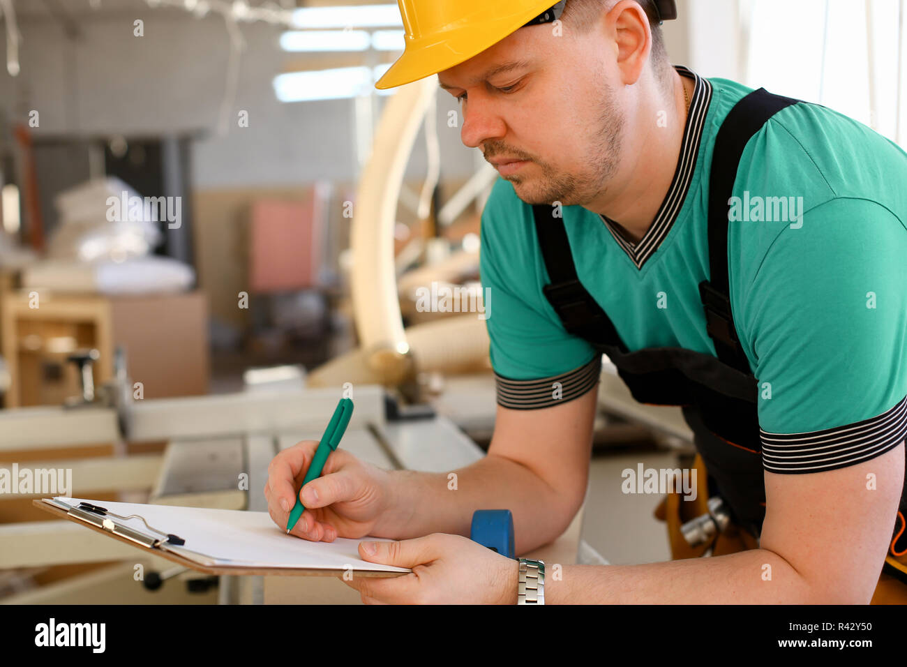 Portrait of young attractive man in work Stock Photo - Alamy