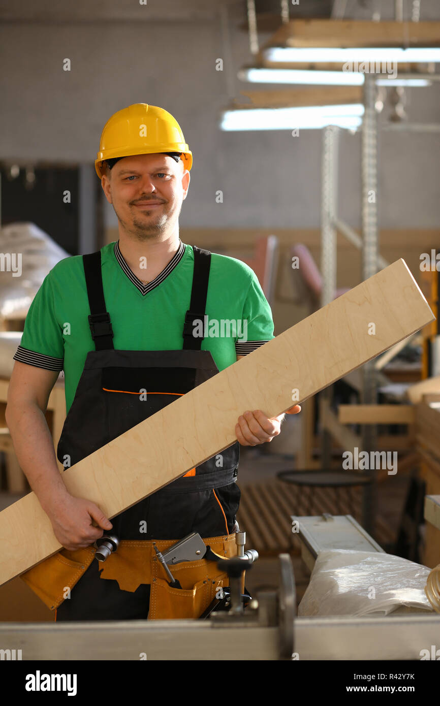 Portrait of a smiling carpenter Stock Photo - Alamy