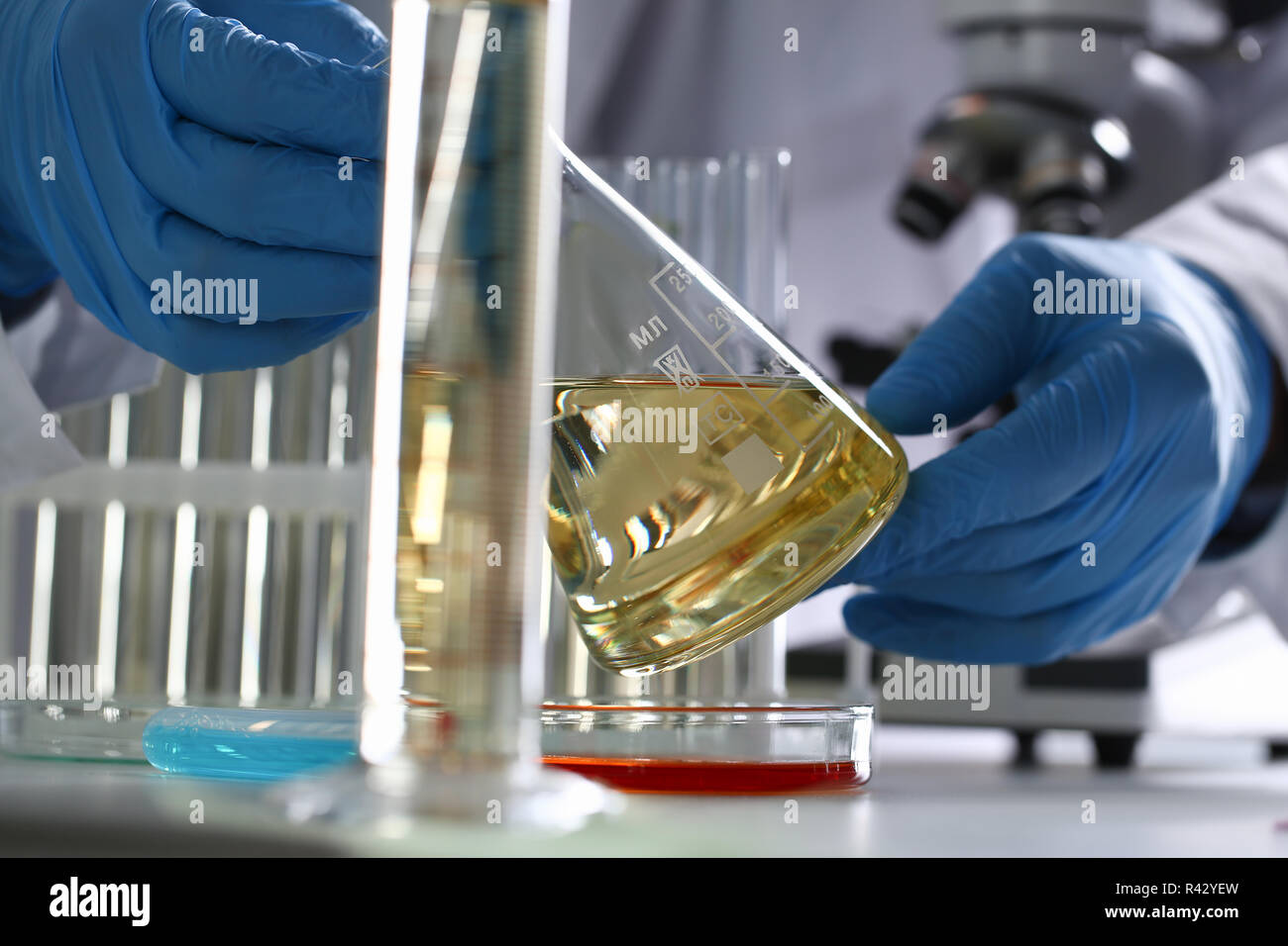 Yellow liquid spilled petrol additive innovative supply Stock Photo - Alamy