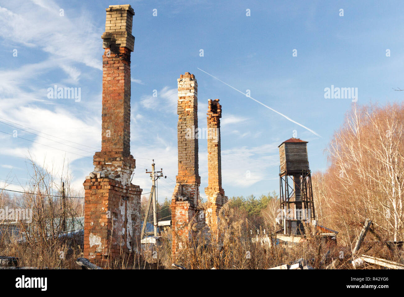 Photo of old broken stone chimney and wooden garret tower Stock Photo ...