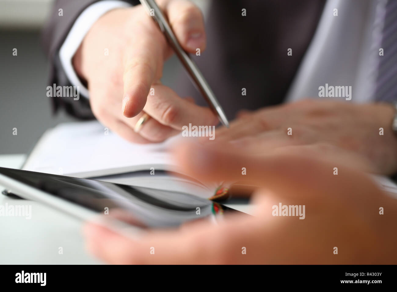Hand of businessman in suit filling Stock Photo - Alamy