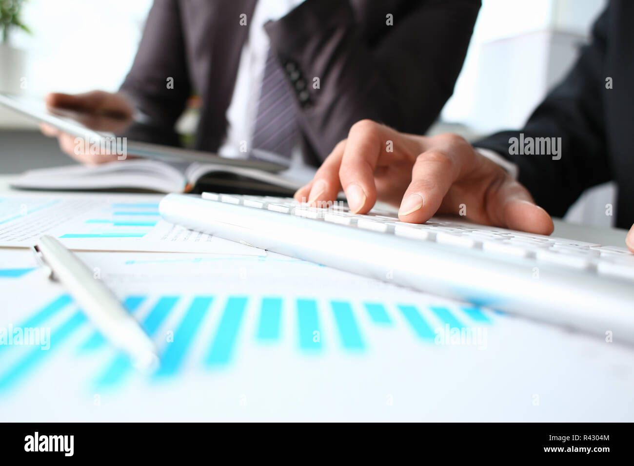 Male arms in suit typing on white Stock Photo - Alamy