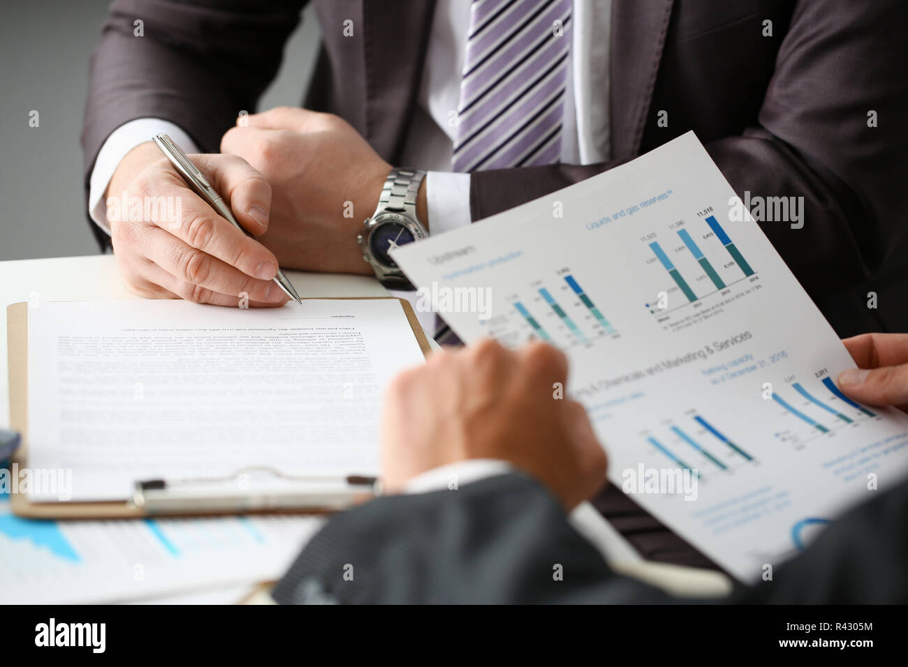 Male arm in suit and tie fill form clipped Stock Photo - Alamy