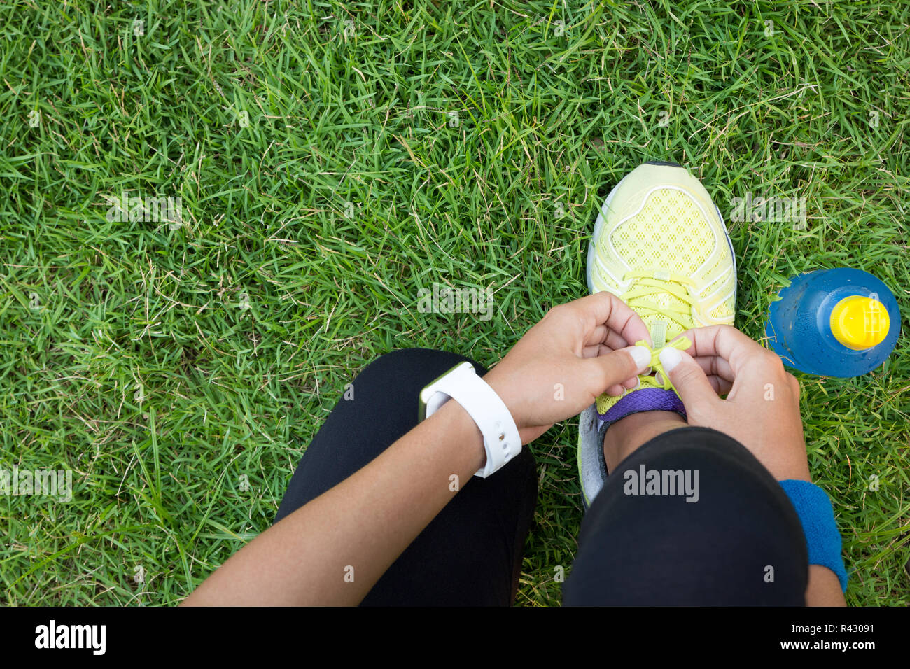 athletic woman tying laces ready to fitness sport Stock Photo - Alamy