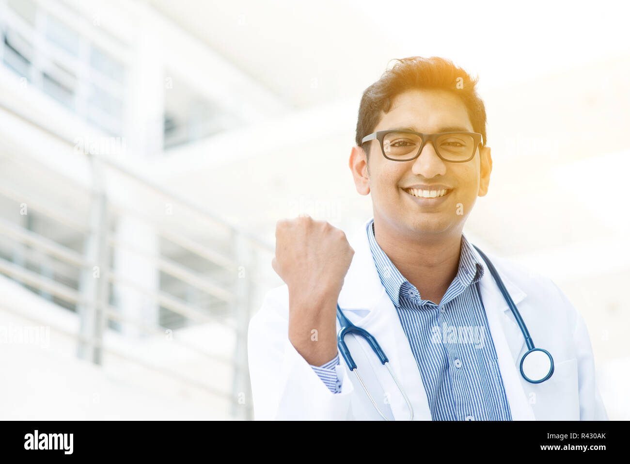 Asian Indian medical doctor celebrating success Stock Photo - Alamy
