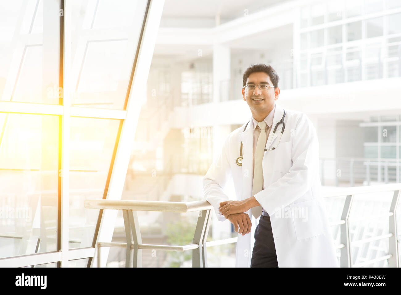Asian Indian medical doctor outside hospital Stock Photo - Alamy