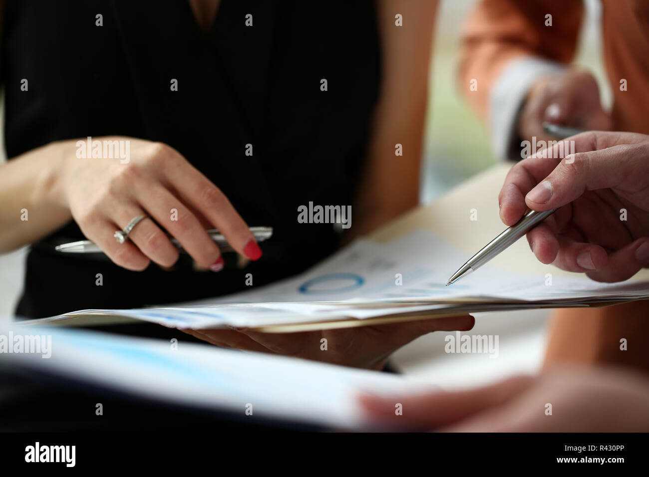 Group of people hold in arms financial papers Stock Photo - Alamy
