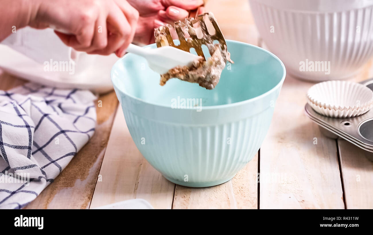 Mixing ingredients together in mixing bowl for blueberry muffins Stock ...