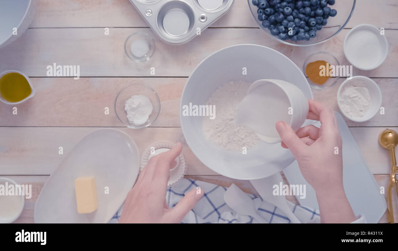 Mixing ingredients together in mixing bowl for blueberry muffins Stock ...