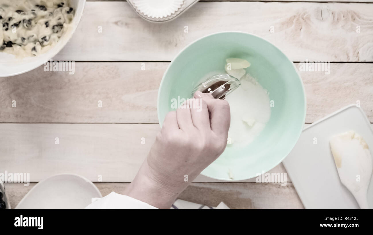 Mixing ingredients together in mixing bowl for blueberry muffins Stock ...