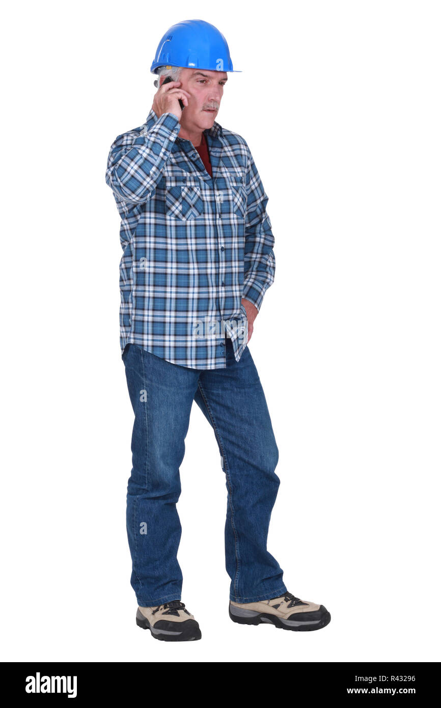 Construction worker making call Stock Photo - Alamy