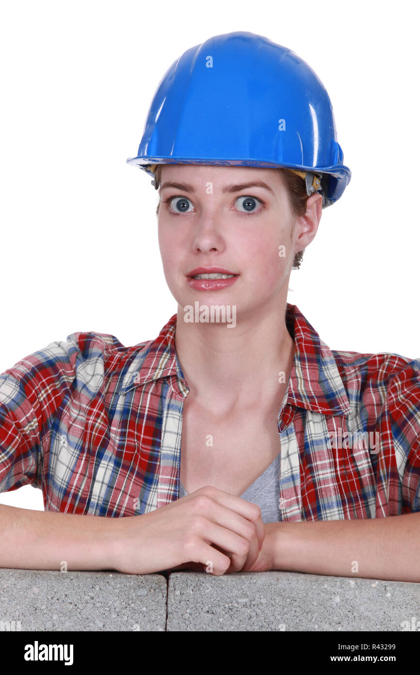 Surprised female mason Stock Photo - Alamy