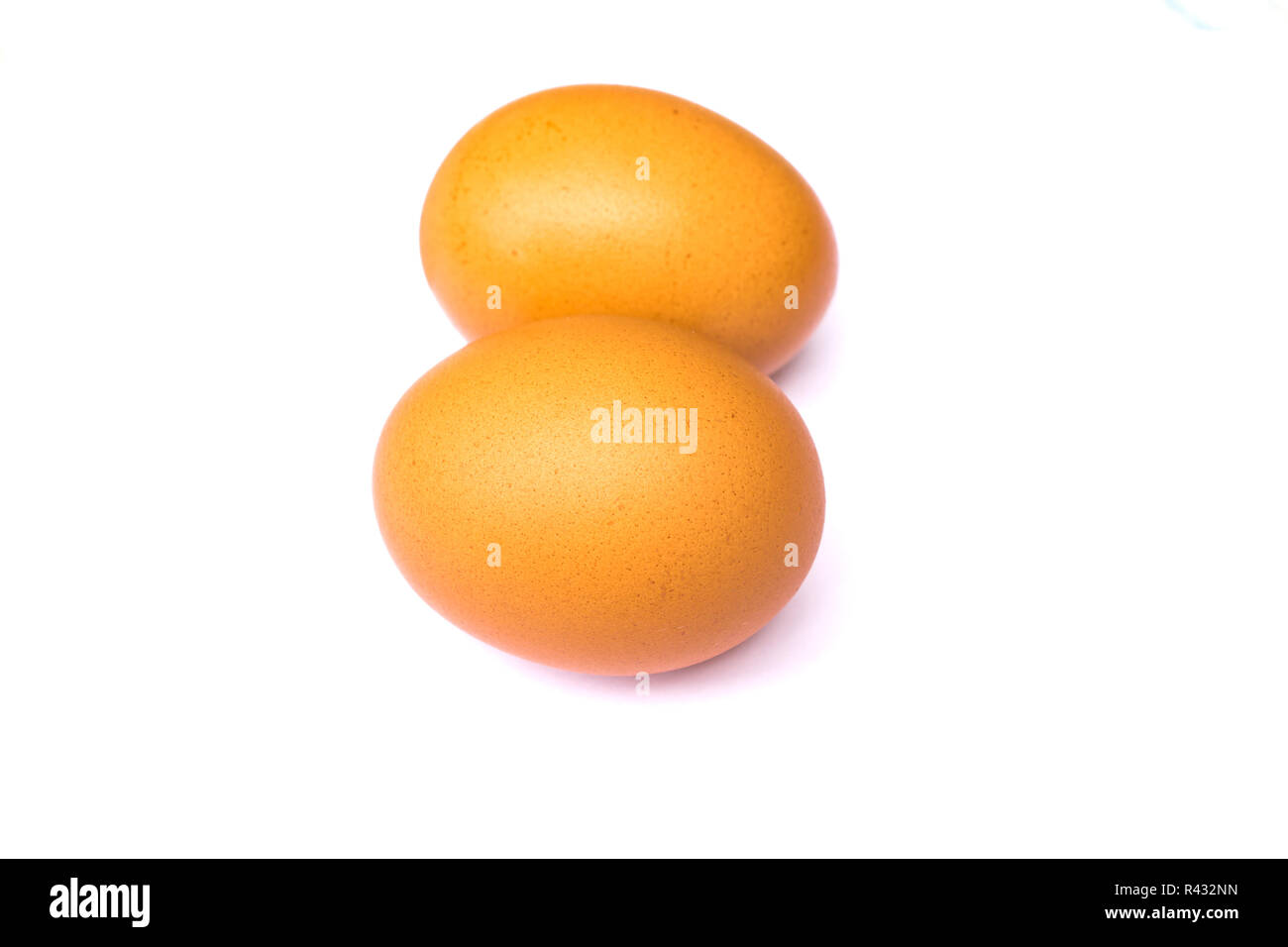 Two eggs on isolation Stock Photo - Alamy