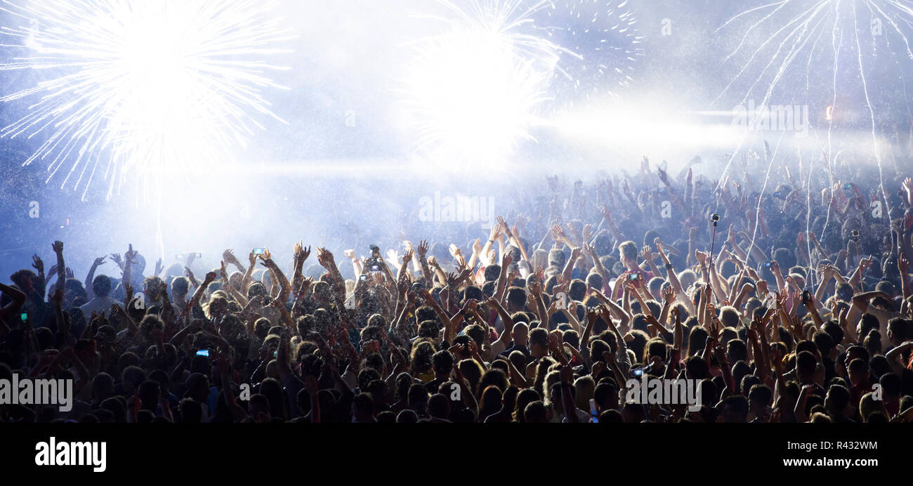 Cheering crowd at concert Stock Photo - Alamy