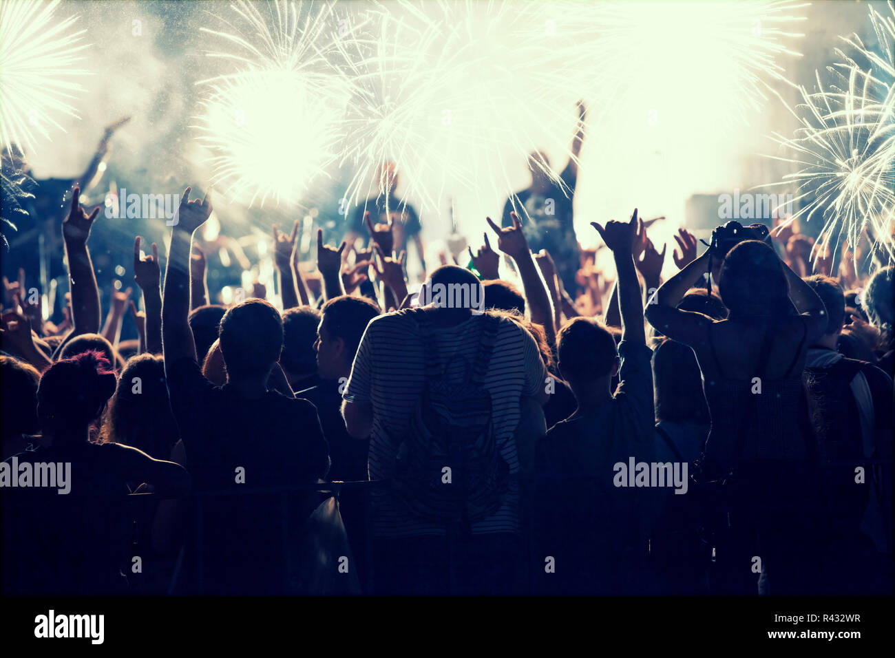 Cheering crowd at concert Stock Photo - Alamy