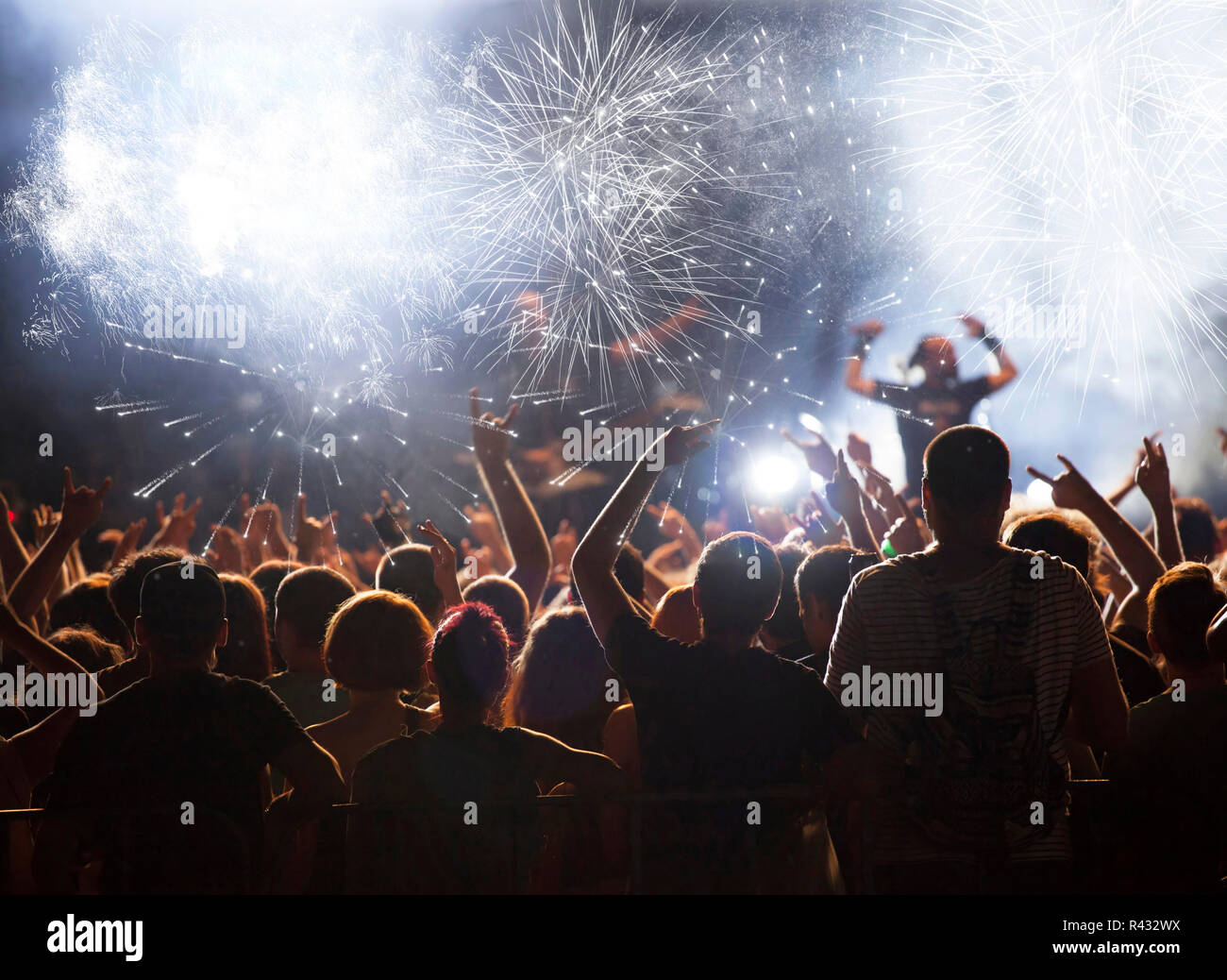 Cheering crowd at concert Stock Photo - Alamy