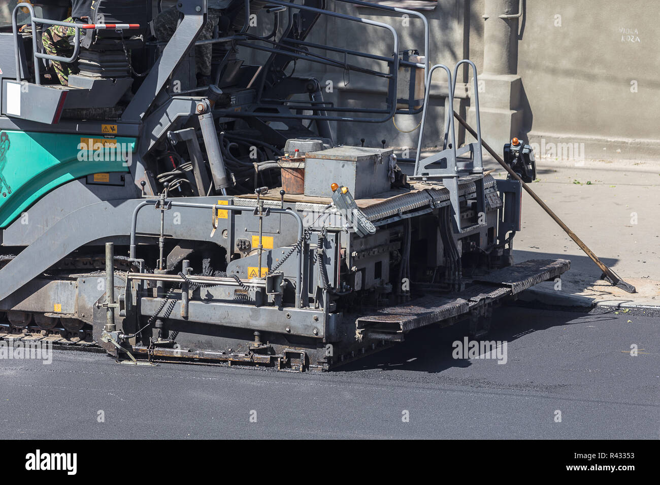 machine for laying asphalt closeup on the street Stock Photo - Alamy