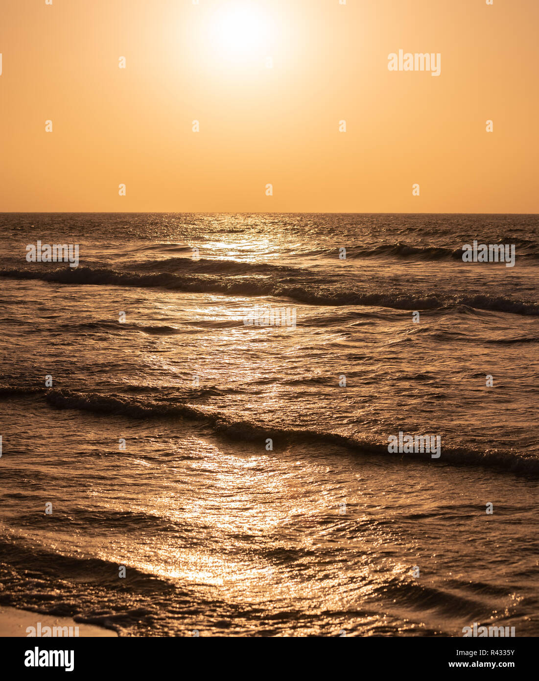 natural sea landscape waves on a sunset background Stock Photo - Alamy