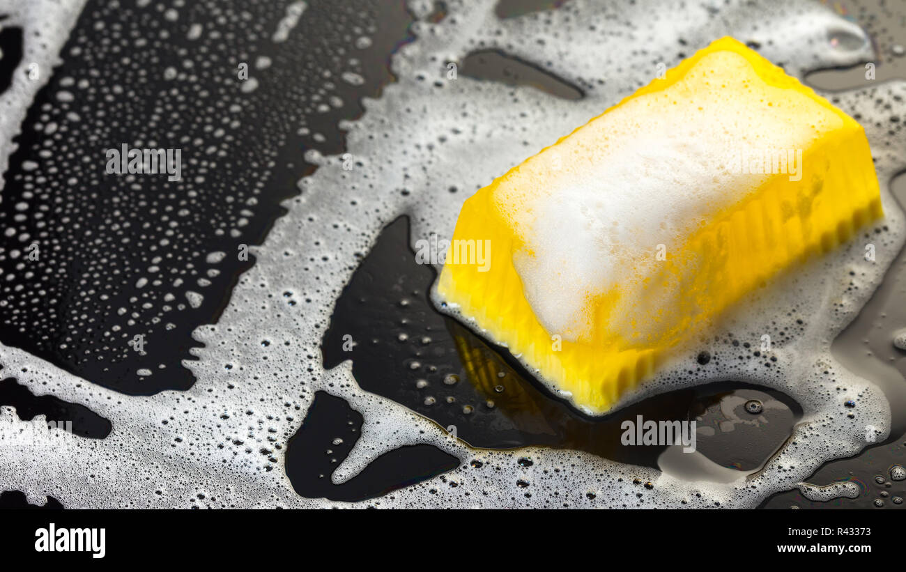yellow flower soap handmade on a black background Stock Photo - Alamy