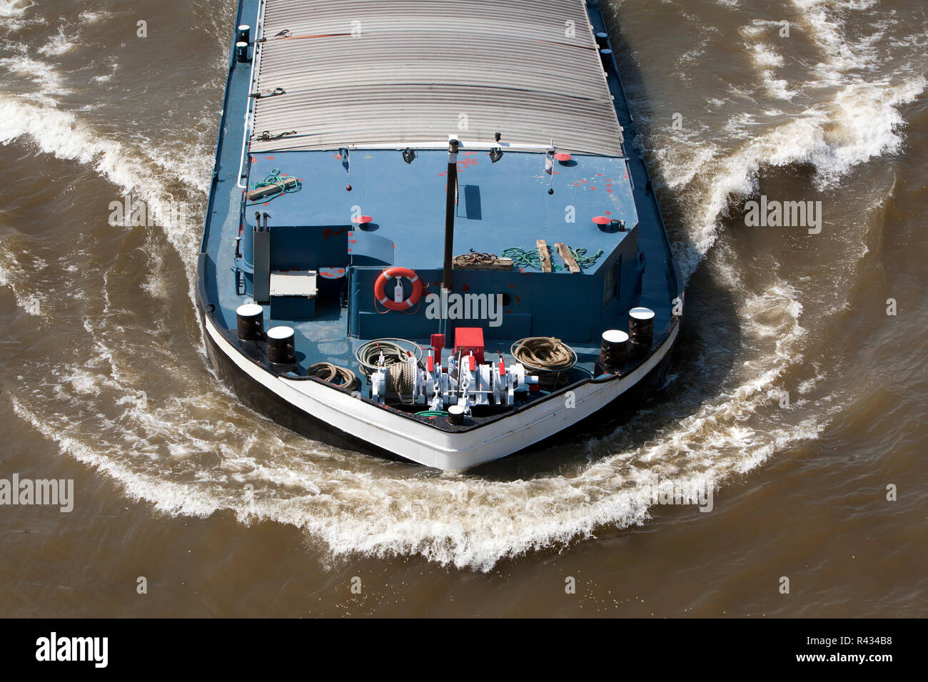 Bow wave of a barge Stock Photo - Alamy