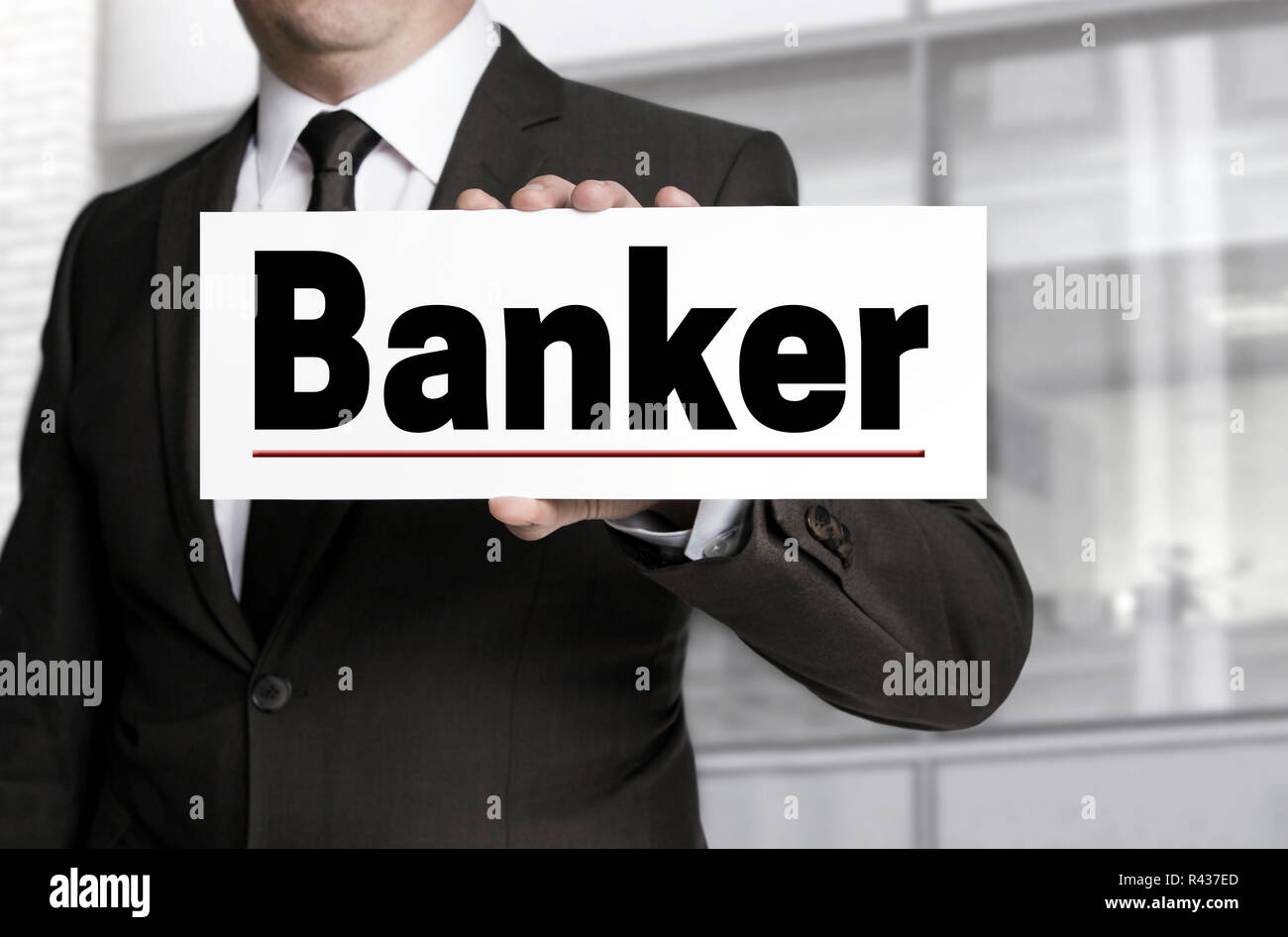 banker shield is held by businessman Stock Photo - Alamy