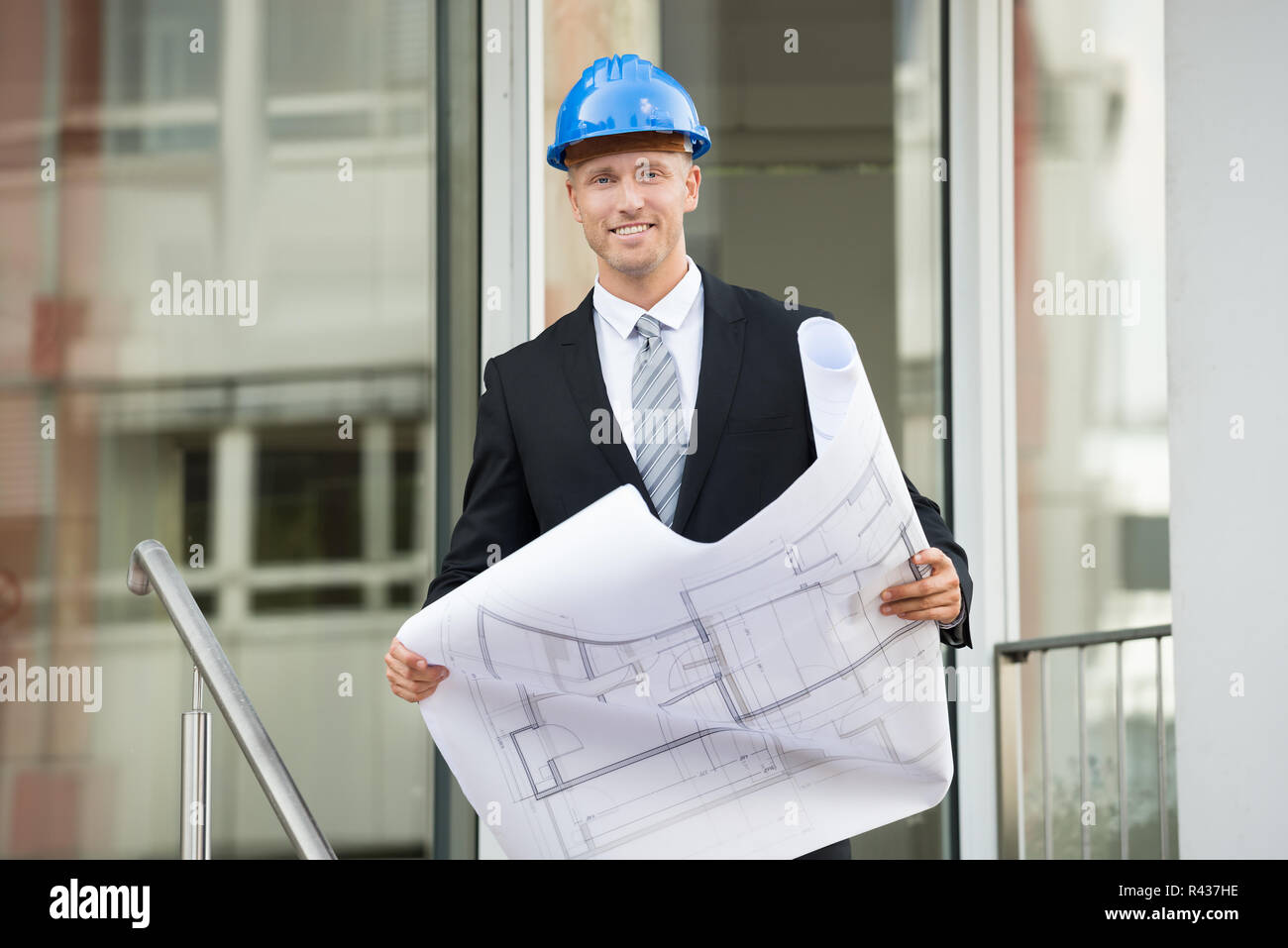 Engineer With Blueprint In His Hands Stock Photo - Alamy