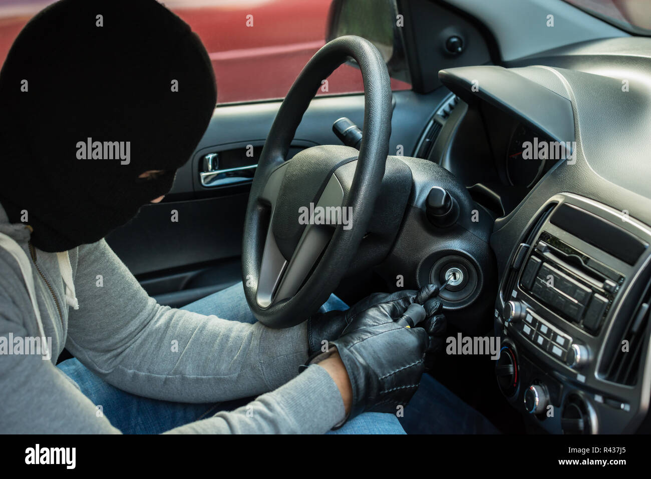 Thief Inserting Tool In Keyhole Stock Photo - Alamy