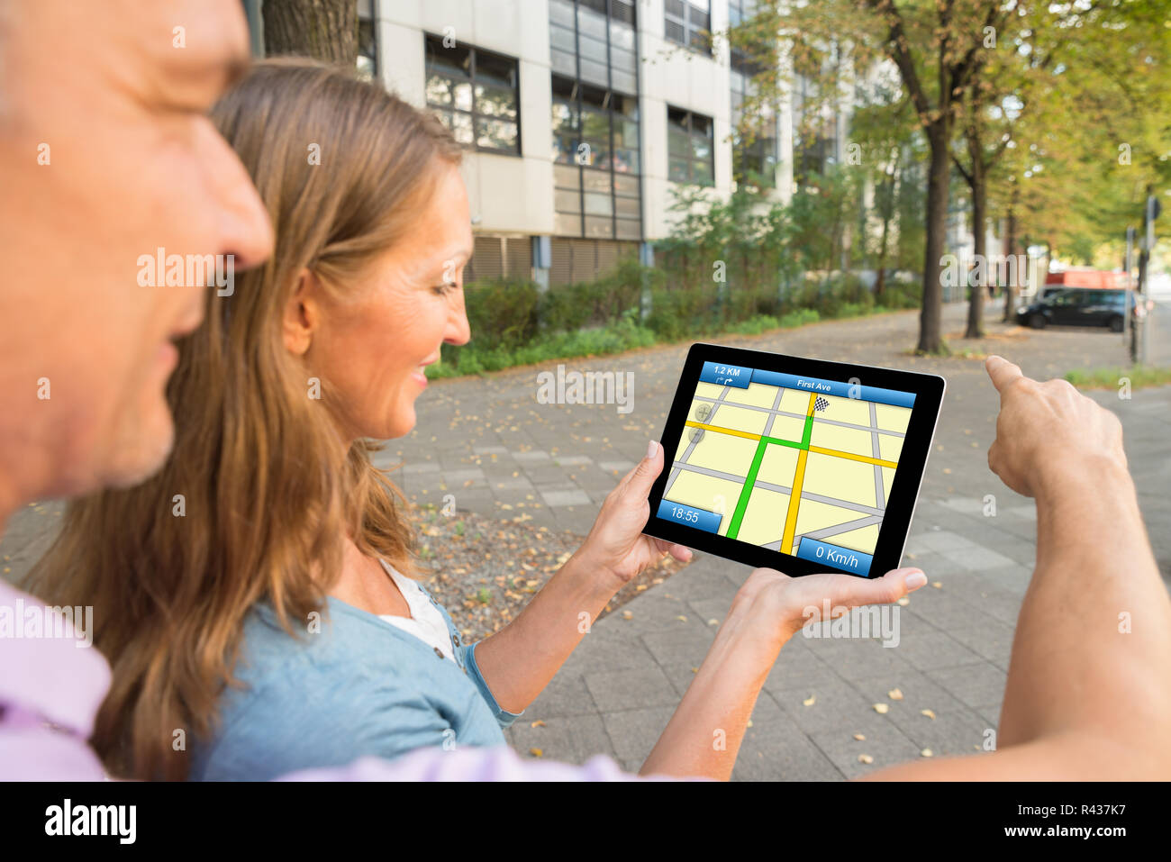 Couple Looking At Gps Map Stock Photo - Alamy