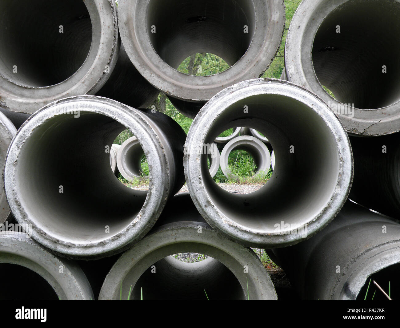 Stacks of concrete tubing and pipes at a construction site Stock Photo ...