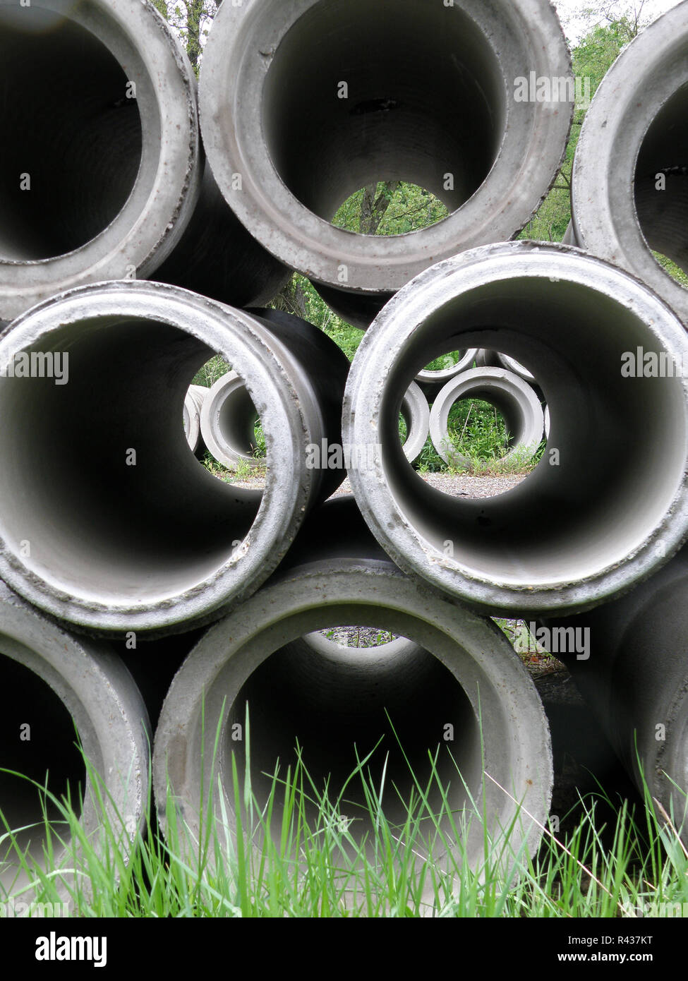Stacks of concrete tubing and pipes at a construction site Stock Photo ...
