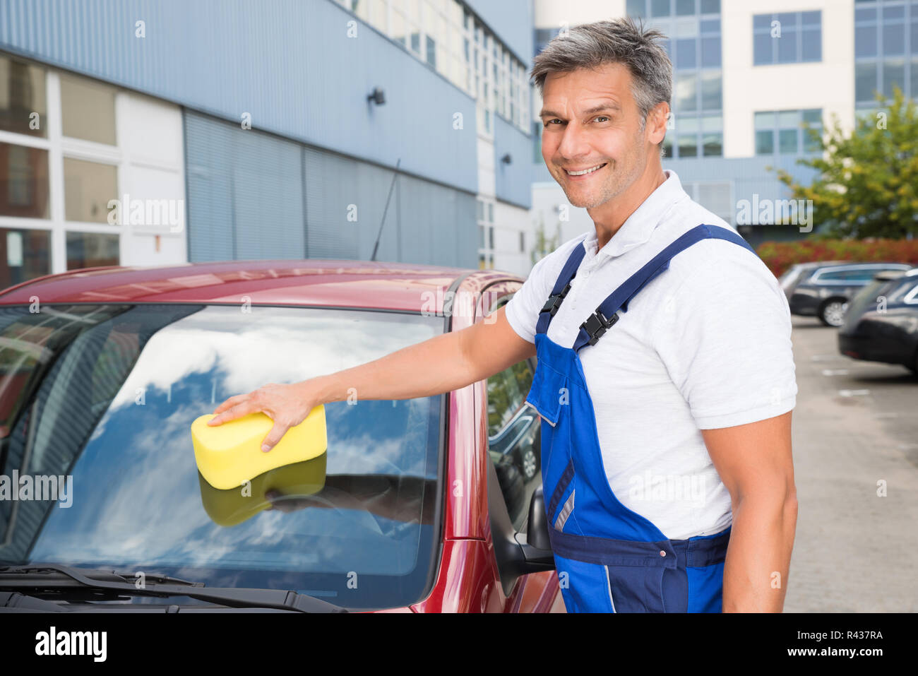 Happy men washing car hi-res stock photography and images - Alamy