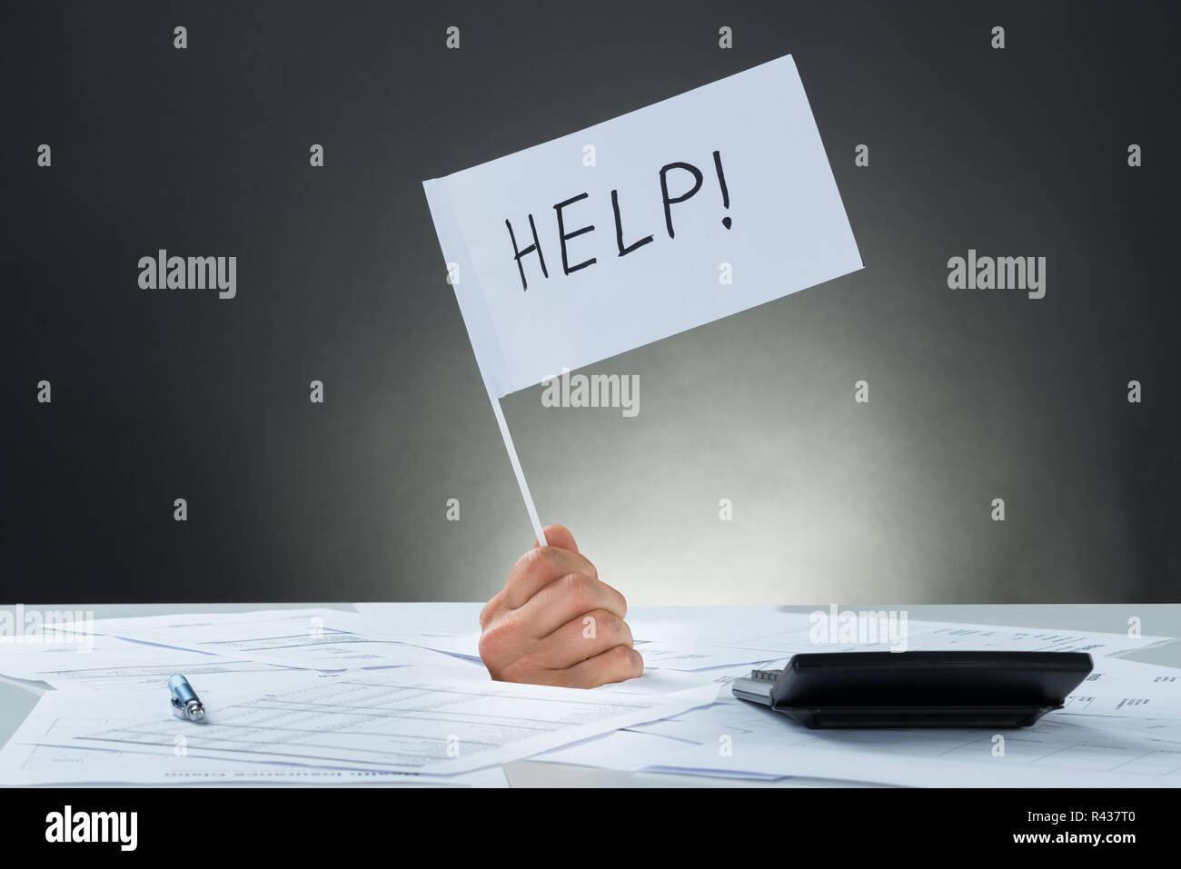 Hand Holding Flag Asking For Help While Emerging From Documents Stock ...