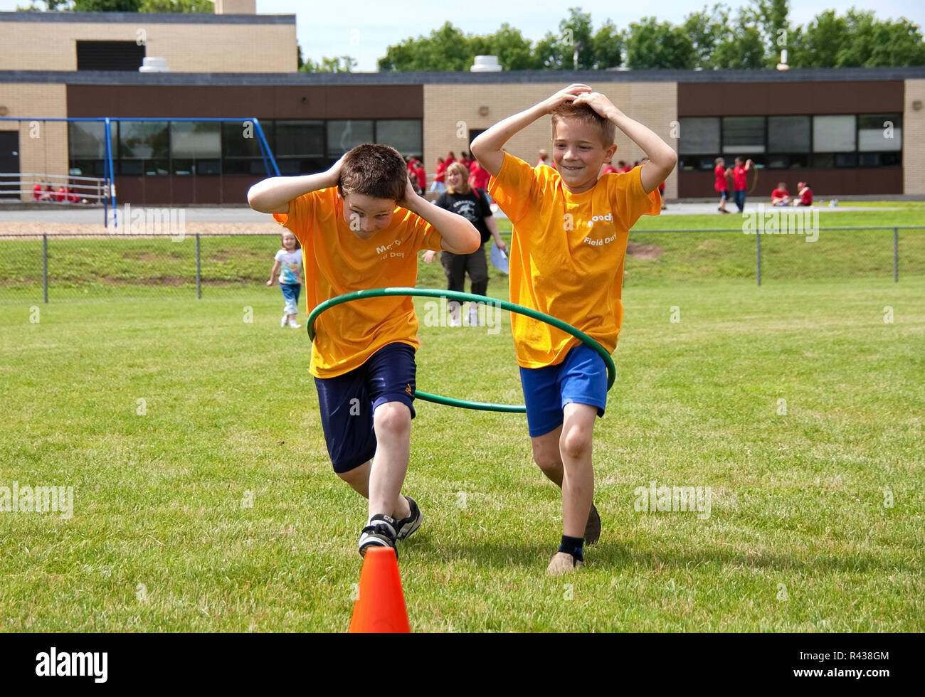 Middletown, CT USA. Jun 2009. Walking boys playing Hula Hoop race or ...