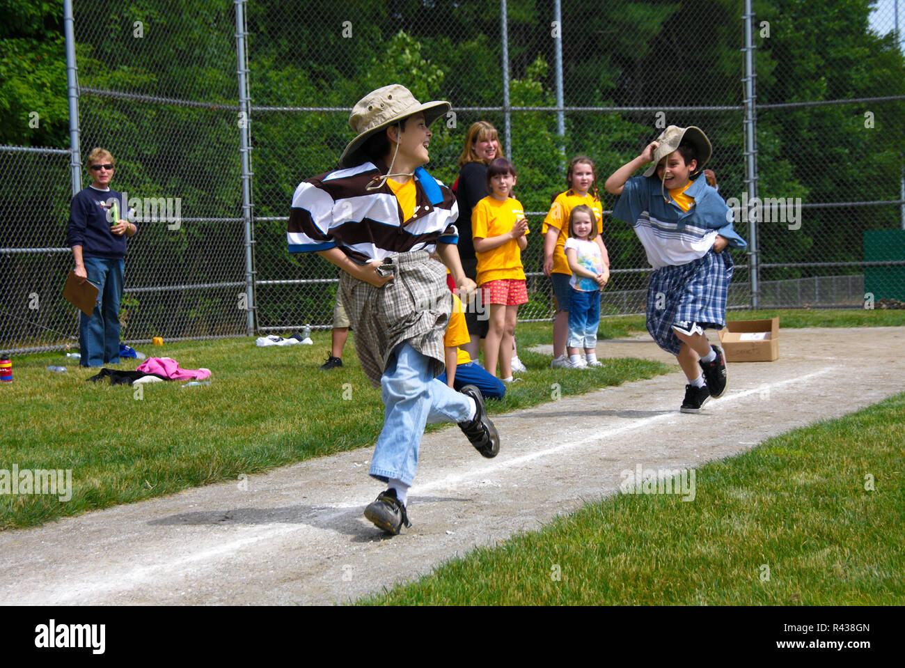 Middletown, CT USA. Jun 2009. Running boys playing clothes change relay ...
