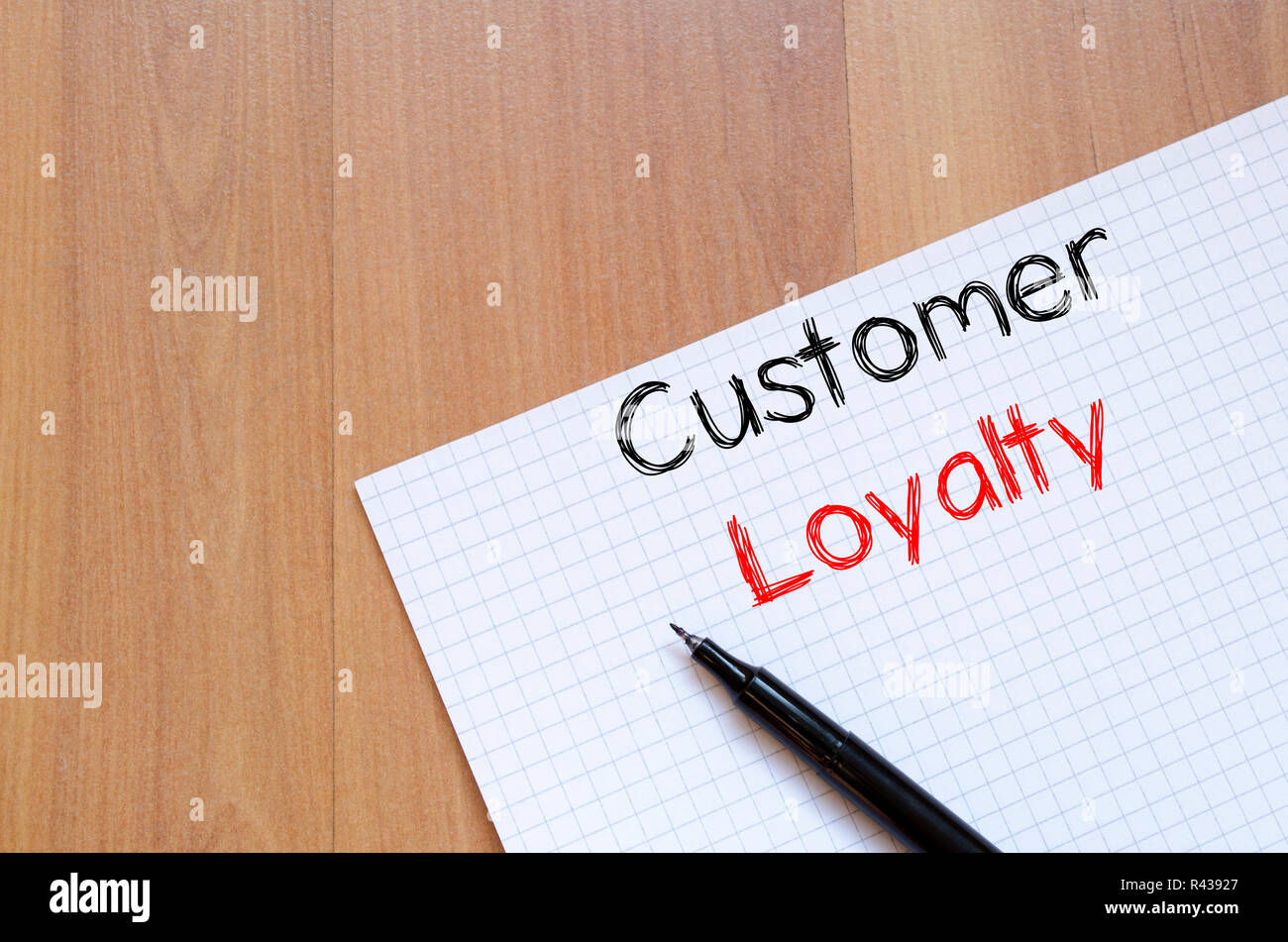 Customer loyalty write on notebook Stock Photo - Alamy