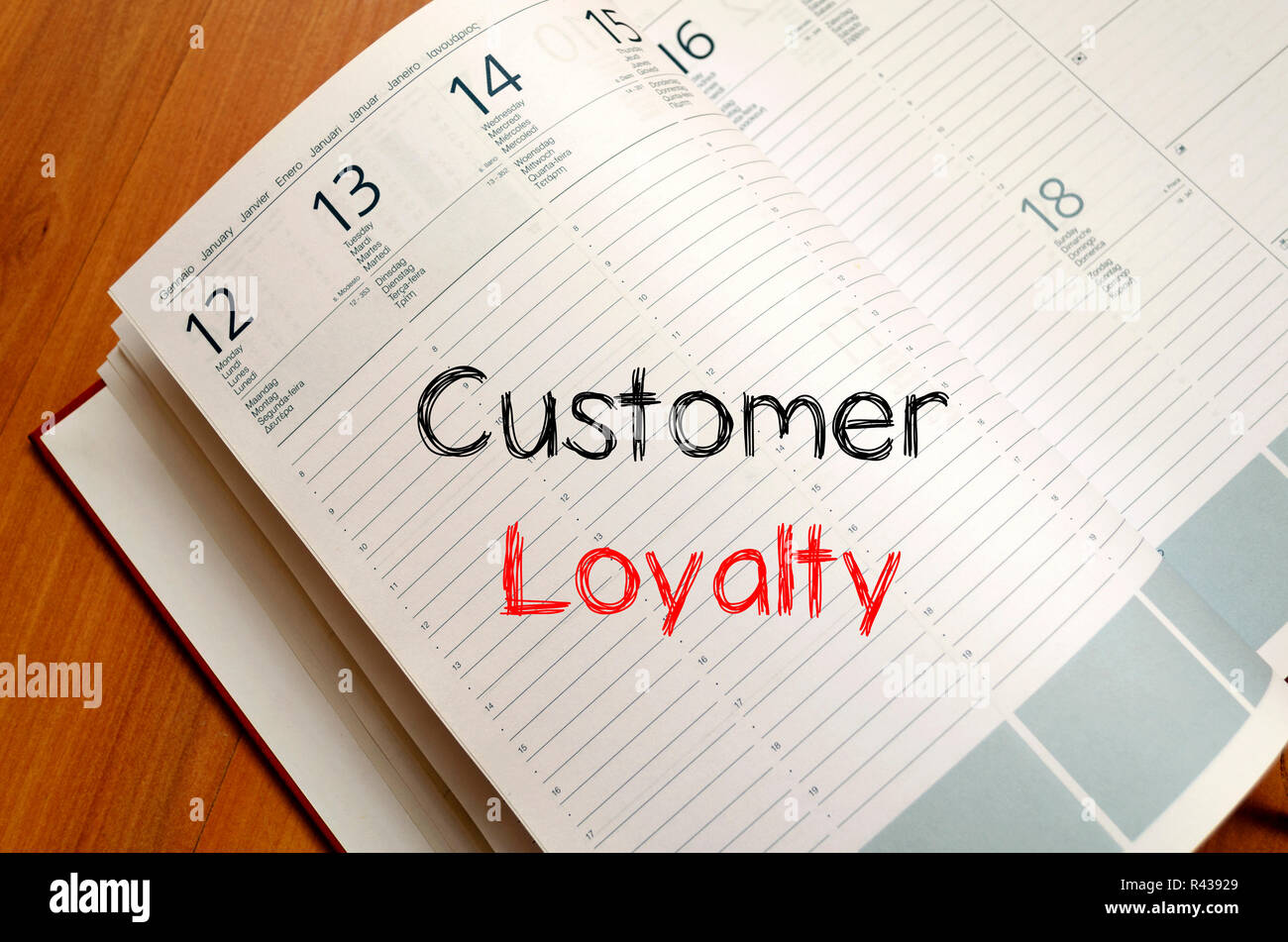 Customer loyalty write on notebook Stock Photo - Alamy