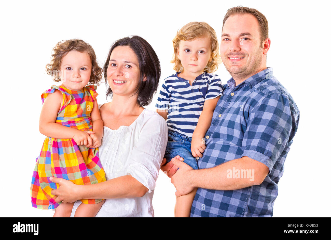 Happy family of four smiling Stock Photo - Alamy