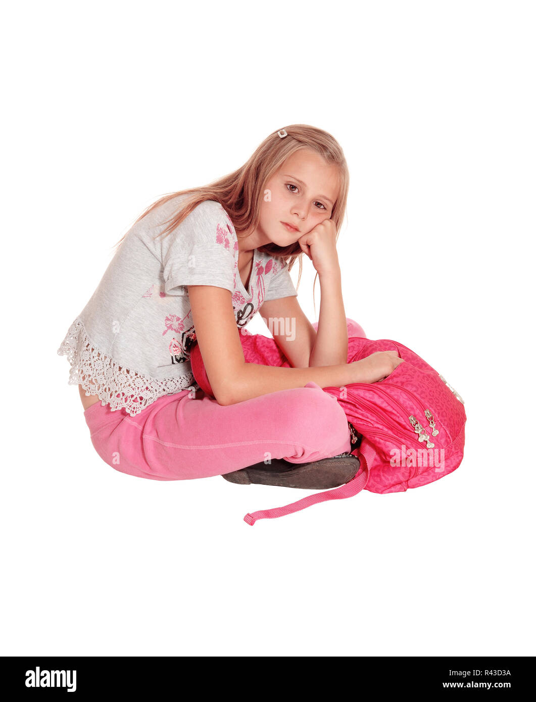 Sad looking girl with pink backpack Stock Photo - Alamy