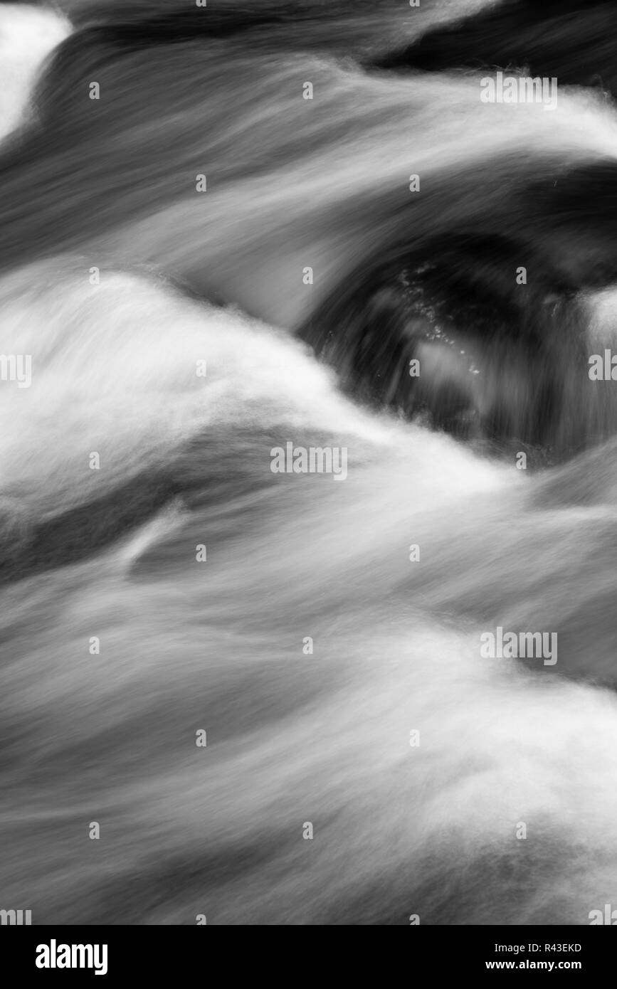 Detail landscape image of river flowing over rocks with long exposure ...