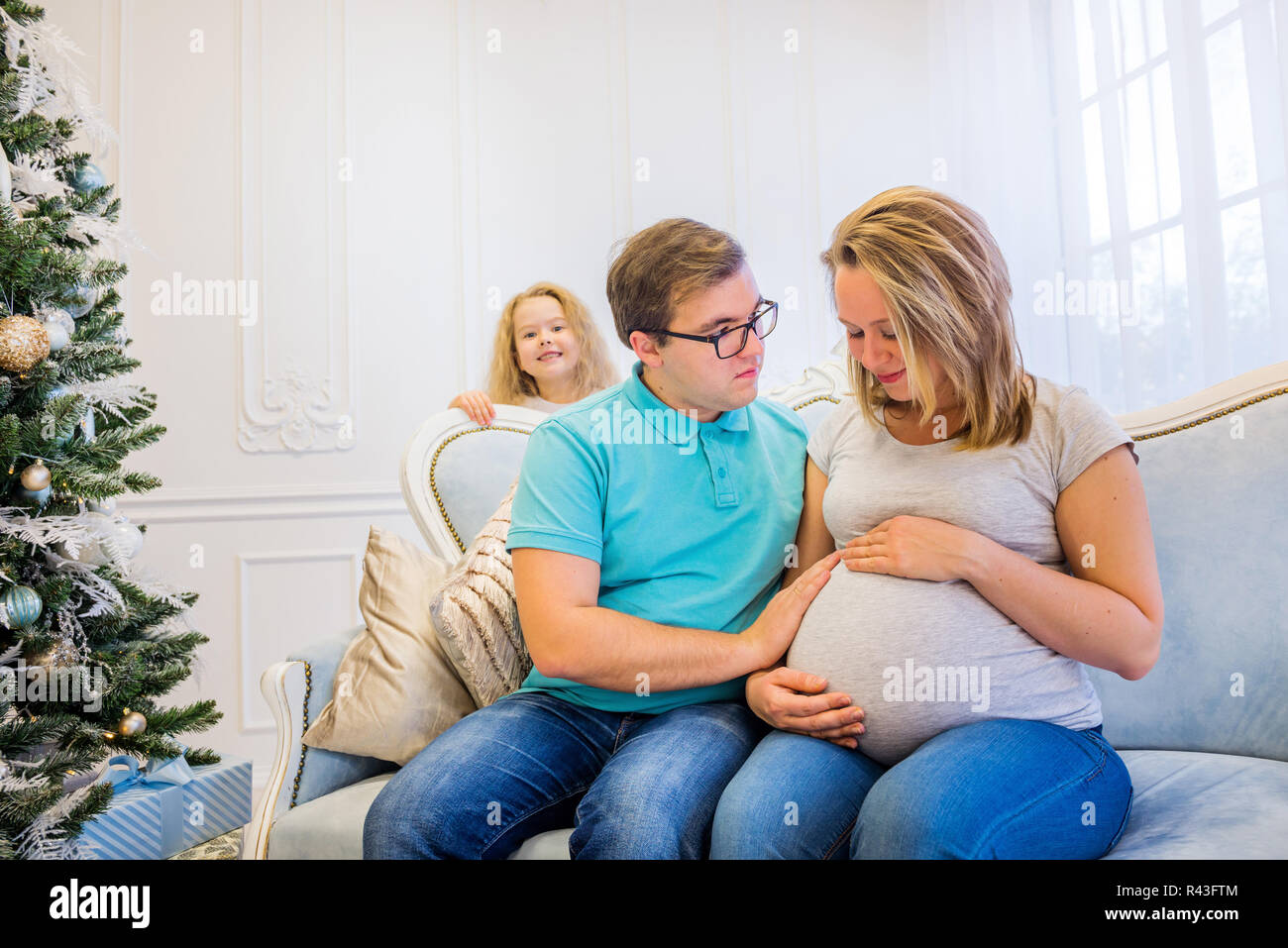 Family portrait near christmas tree Stock Photo - Alamy