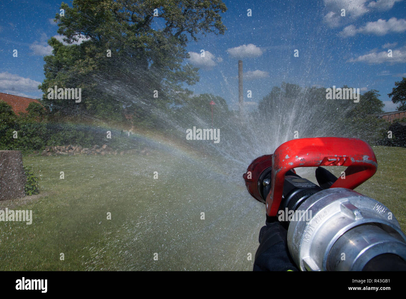 firemen lance in use Stock Photo - Alamy