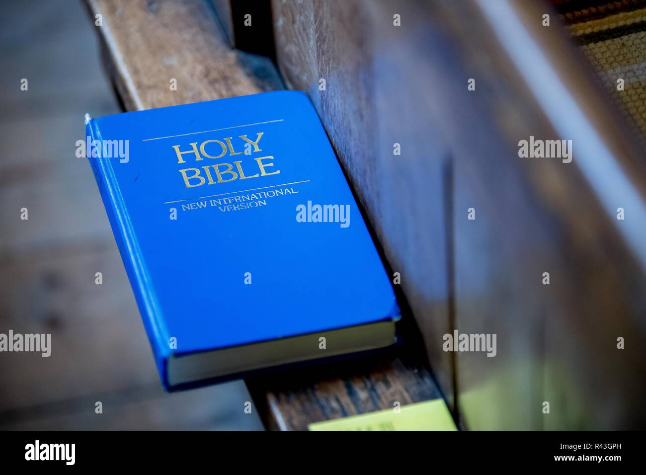 Holy bible inside a church Stock Photo - Alamy