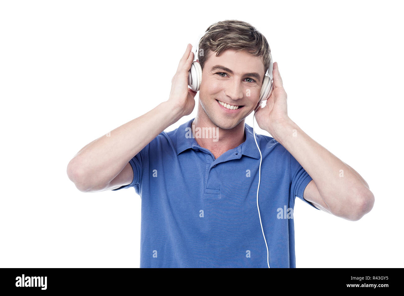 Young guy listening to music Stock Photo - Alamy