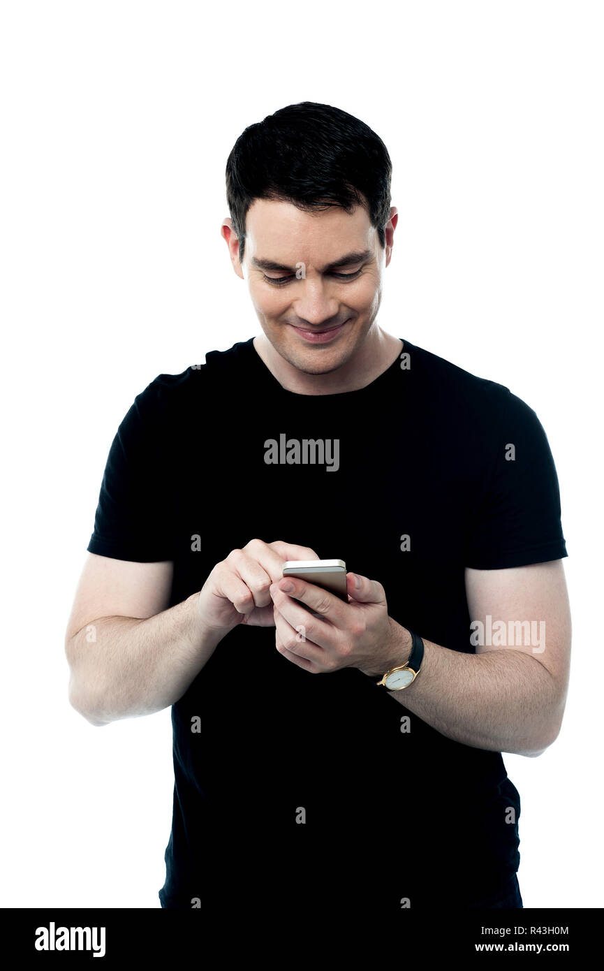 Man using mobile to send text message Stock Photo - Alamy