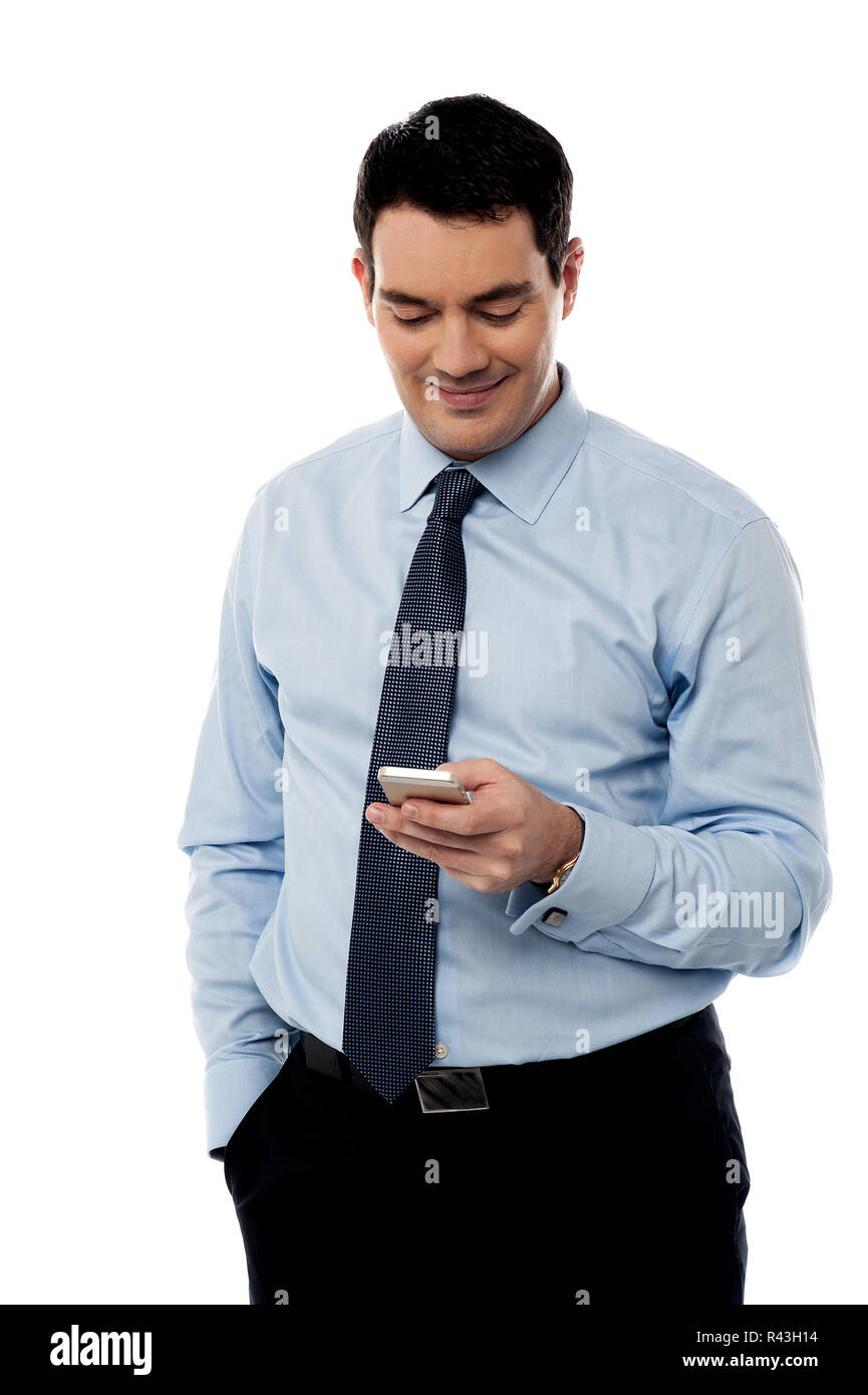 Corporate guy sending emails from phone Stock Photo - Alamy