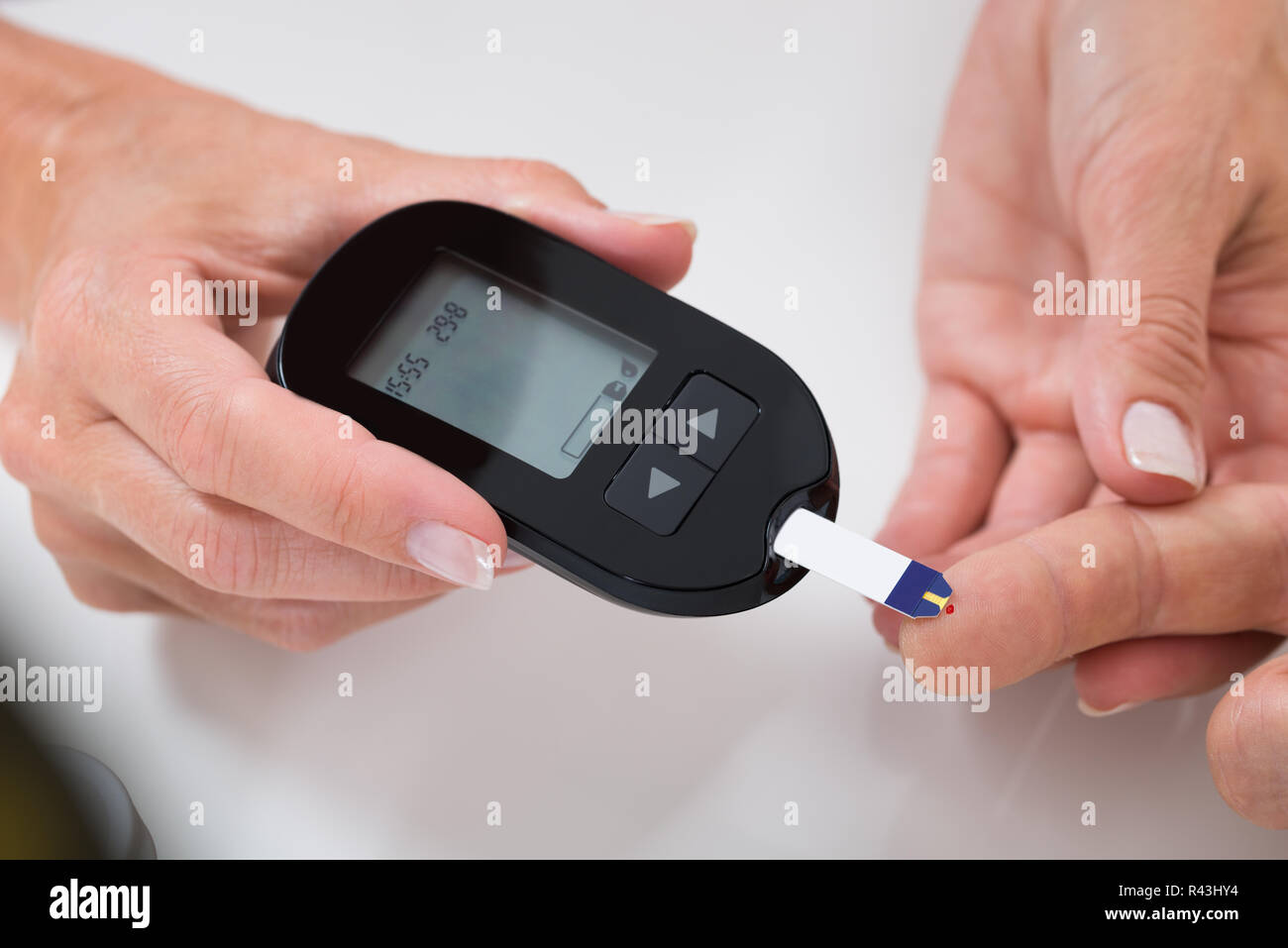 Doctor Measuring Sugar Reading Of Patient Stock Photo - Alamy