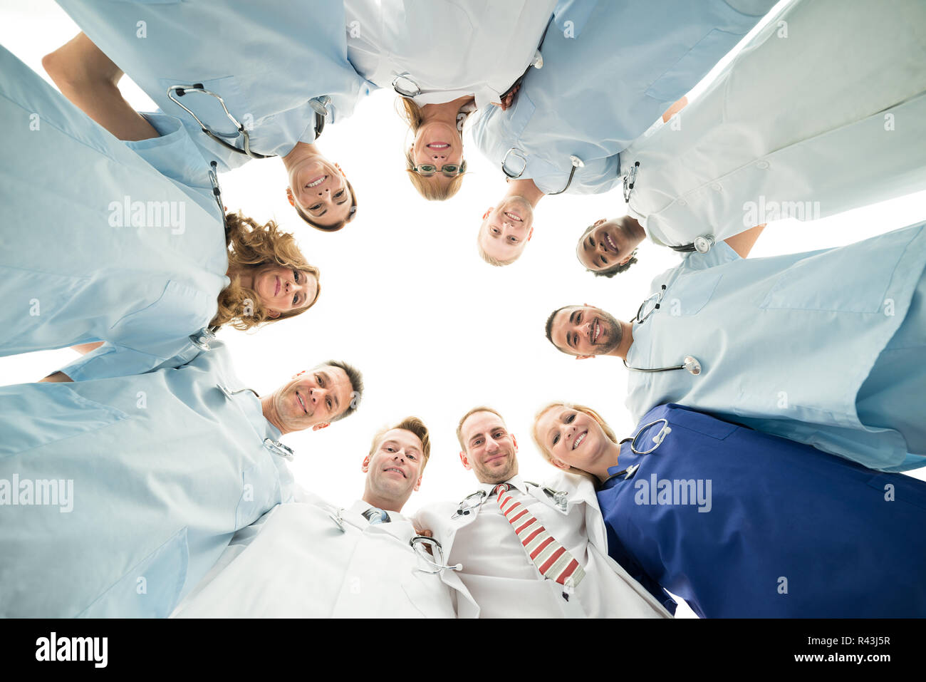 Portrait Of Confident Medical Team Standing In Huddle Stock Photo - Alamy