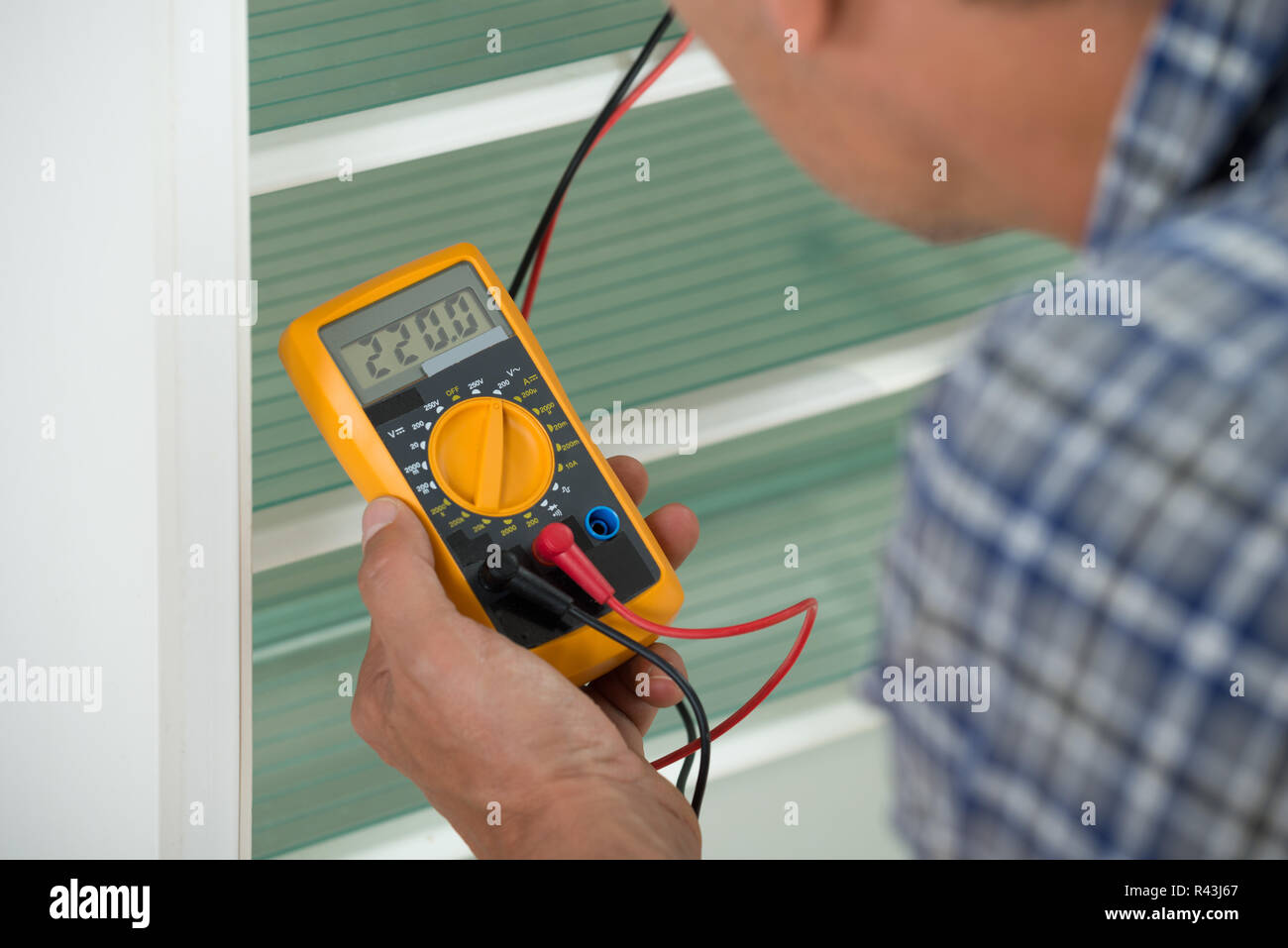 Repairman Checking Fridge With Digital Multimeter Stock Photo - Alamy